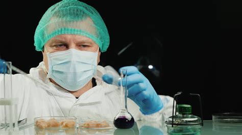 Premium Stock Video Lab Technician Examines The Meat Samples In The Lab