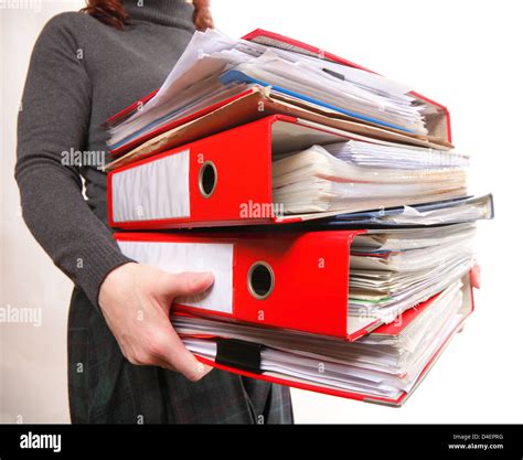 Woman In Grey Holding Stack Of Folders Pile With Old Documents And Bills Isolated On White