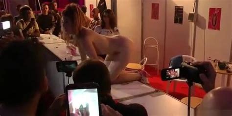 brunette takes facial at euro sex expo