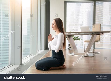 Young Woman Sitting On Her Feet Knees Together Over 49 Royalty Free