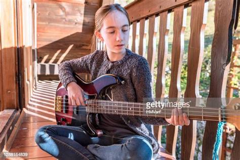Girl Playing Bass Guitar Photos And Premium High Res Pictures Getty