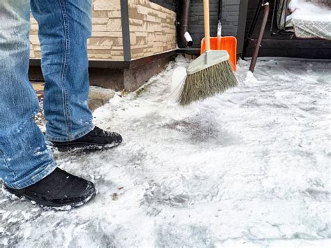 winter snow removal activity in residential area showing a person