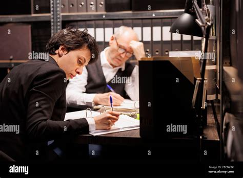 Inspectors Working Overtime At Criminal Investigations In Arhive Room Analyzing Mysterious