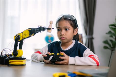 Asian Girls Were Learning Robot Programming And Getting Lessons Control On Robot Arms Laboratory