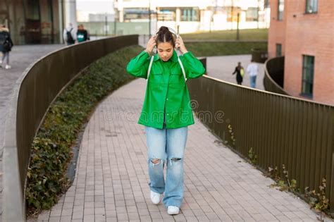 Teen Student Girl Walking Near University Building Outdoors Wearing