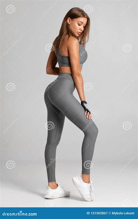Sexy Fitness Woman Beautiful Athletic Girl Isolated On The Gray