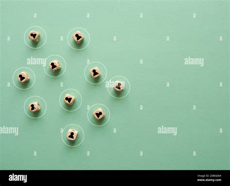 Small Wooden Blocks With Character Icons And A Circle Around Them As A Symbol For Social