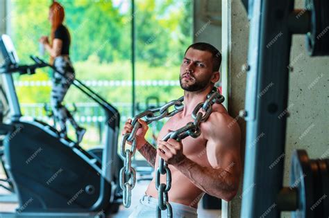 Premium Photo Muscular Man Lifting Weights At Gym Handsome Guy