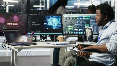Data Center Engineer In Wheelchair And Coworkers Fighting Security