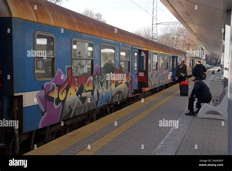 Passengers Getting On A Train Hauled By A Seimens Vectron Electric