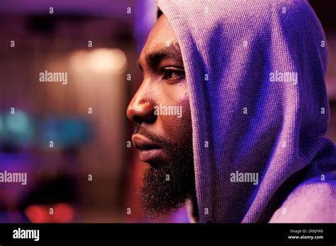 Concentrated African American Man In Hood Breaking Into Computer System