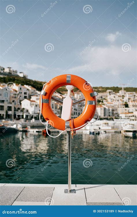Lifebuoy On A Stand With A Latch Stands On The Shore Of Lustica Bay