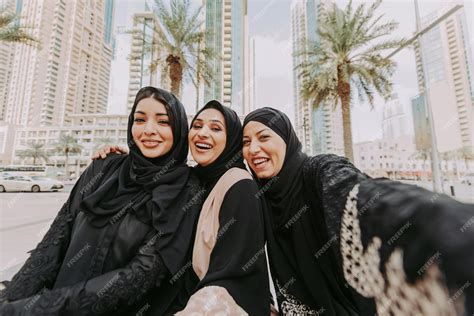 Premium Photo Arabic Women With Abaya Bonding And Having Fun Outdoors