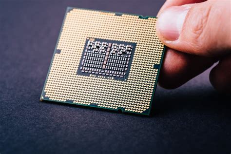 CPU Processor Chip Computer On Dark Black Background Holding In Hand Stock Photo Image Of