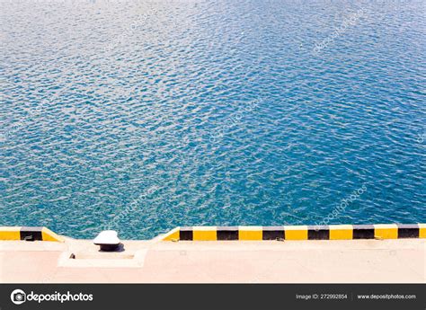 Empty Quay In The Sea Port White Mooring Bollard Export Import Logistic Commercial