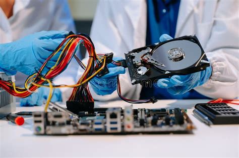 Technician Repairing Inside Of Hard Disk Drive By Screwdriver The Concept Of Data Hardware