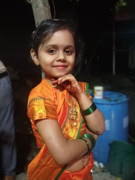 Premium Photo Portrait Of Smiling Girl Standing Outdoors