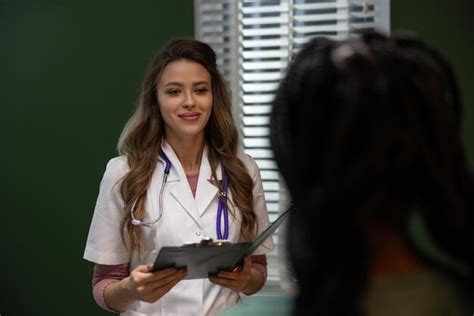 Premium Photo In The Hospital The Doctor Tells The African Patient