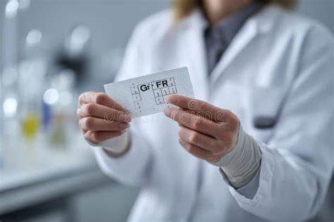 Lab Technician Holds Gfr Test Results In A Modern Laboratory Setting
