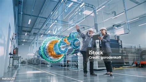 공장 디지털화 두 명의 산업 엔지니어가 태블릿 컴퓨터를 사용하여 청정 녹색 에너지 엔진의 3d 모델을 시각화합니다 기계 제조 제품을 갖춘 산업 4 첨단 전자 시설 엔지니어에