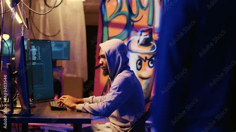 Rogue Programmer Welcoming New Member In Hacking Group Showing Him Around Underground Hideout