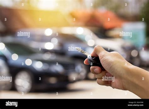 Female Hand Presses On The Remote Control Car Alarm Systems With Sunlight Stock Photo Alamy