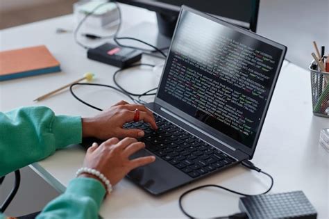 Premium Photo Closeup Of Woman Typing Codes On Laptop While Working
