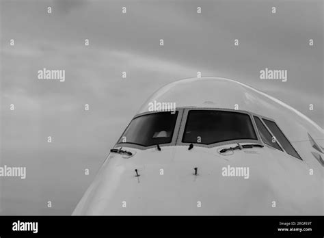 View Of The Nose And Cockpit Window Of A Boeing 747 At The Airport Of