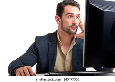 Surprised Man Looking Computer Screen Thinking Stock Photo 143477305 Shutterstock