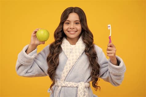 Apple Vitamins For Healthy Teeth Teenager Girl Brushing Her Teeth Over Isolated Yellow