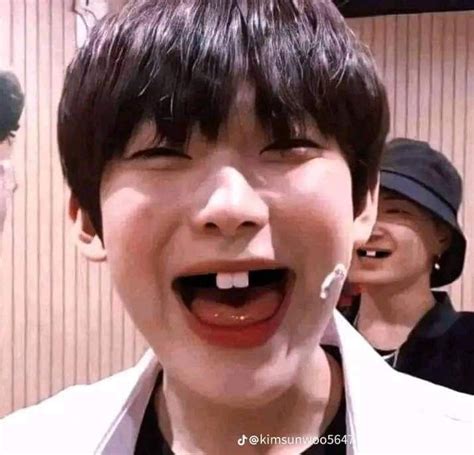 A Young Man With His Mouth Open And Tongue Out