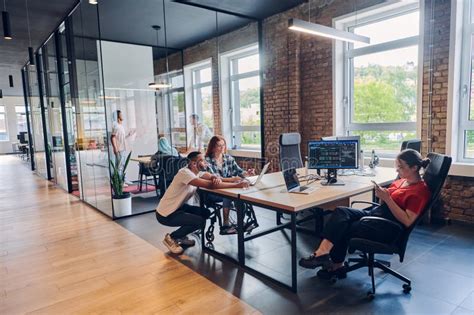 A Diverse Group Of Business Professionals Collaborates In A Modern