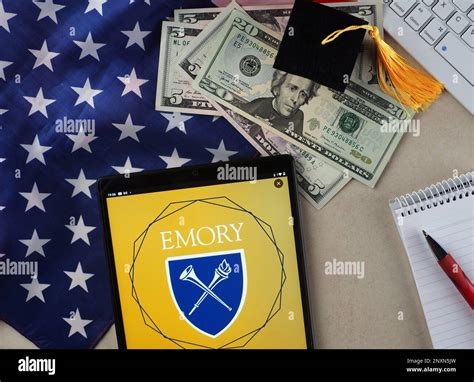 In This Photo Illustration Emory University Logo Seen Displayed On A