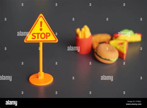 Closeup Image Of Stop Signboard And Junk Foods Stop Eating Unhealthy