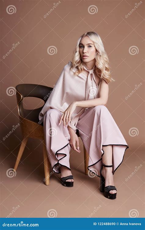 Luxurious Woman In A Dress Sitting On A Chair Autumn Collection Of