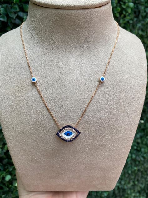 18 Karat Rose Gold Sapphire And Diamond Evil Eye Pendant Necklace For