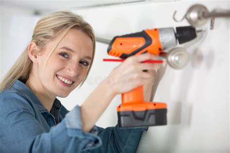 Woman Securing Curtain Rail Using Cordless Drill Stock Photo Image Of Female Industry 271543012