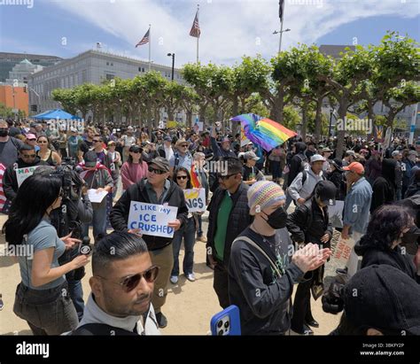 A Large Crowd Of Protestors Hold Signs At The San Francisco Civic