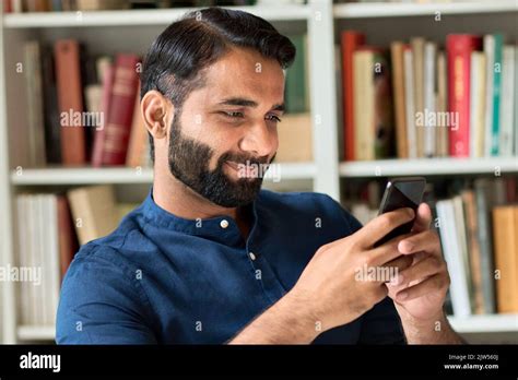 Indian Business Man Holding Smartphone Using Mobile Phone At Home Or In Office Stock Photo Alamy