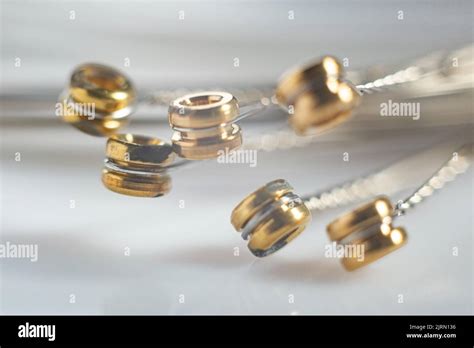 Macro Details Of Strings For Electric Guitar On A White Background
