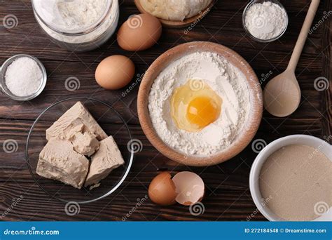 Different Types Of Yeast Eggs Salt Dough And Flour On Wooden Table Flat Lay Stock Photo