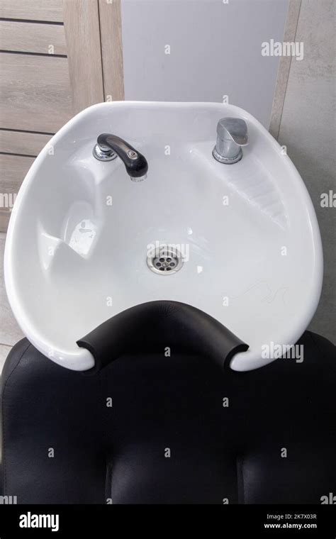 Professional White Wash Basin In The Interior Of A Beauty Salon