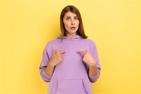 Premium Photo Woman Pointing Herself And Looking At Camera With