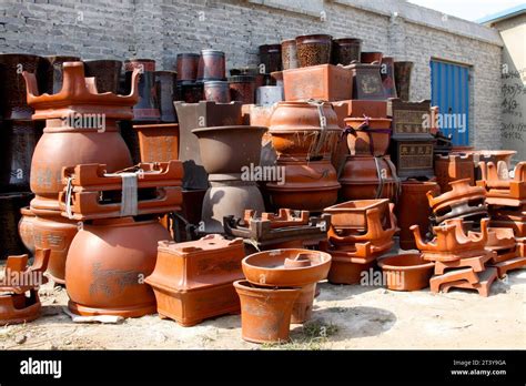 Flowerpot And Flower Gardening Tools Stacked Together In A Shop Stock