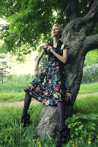 Premium Photo Young Woman Posing On A Tree