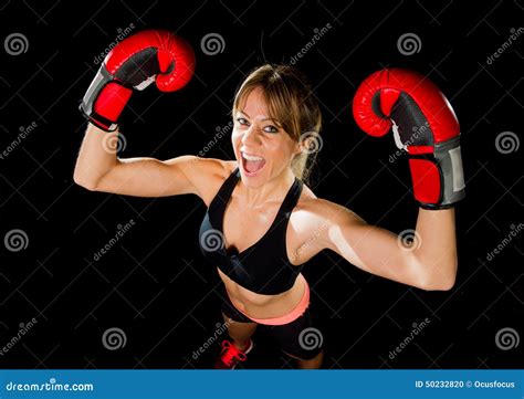 Young Happy Beautiful Boxer Girl With Boxing Gloves Arms In Victory