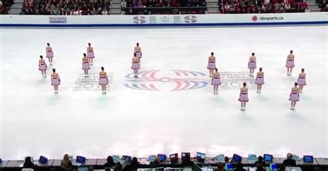 Sixteen Ice Skaters Stand Totally Still But When The Music Starts