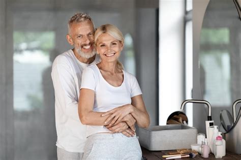 Premium Photo Happy Mature Spouses Embracing In Bathroom While