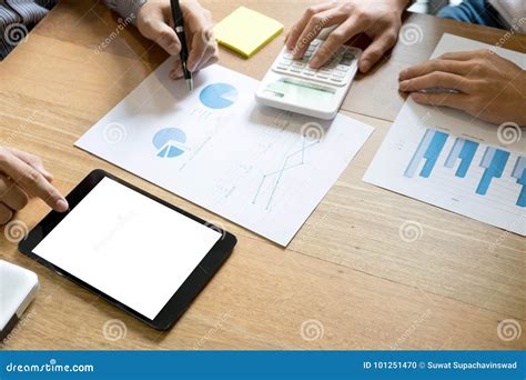 Two Businessman Working Use Computer And Analysis Paper Graph On Stock