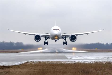 Modern Passenger Airplane Landing On Airstrip In Winter 55303521 Stock